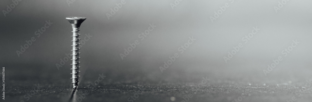 partially screwed threaded screw wood dark background Stock Photo ...