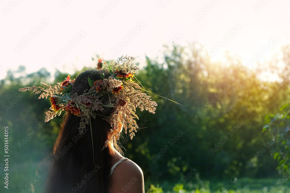Girl in flower wreath on meadow, sunny green natural background. Floral ...