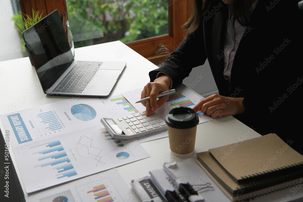 Financial advisor calculating numbers datasheets graphs charts reports ...