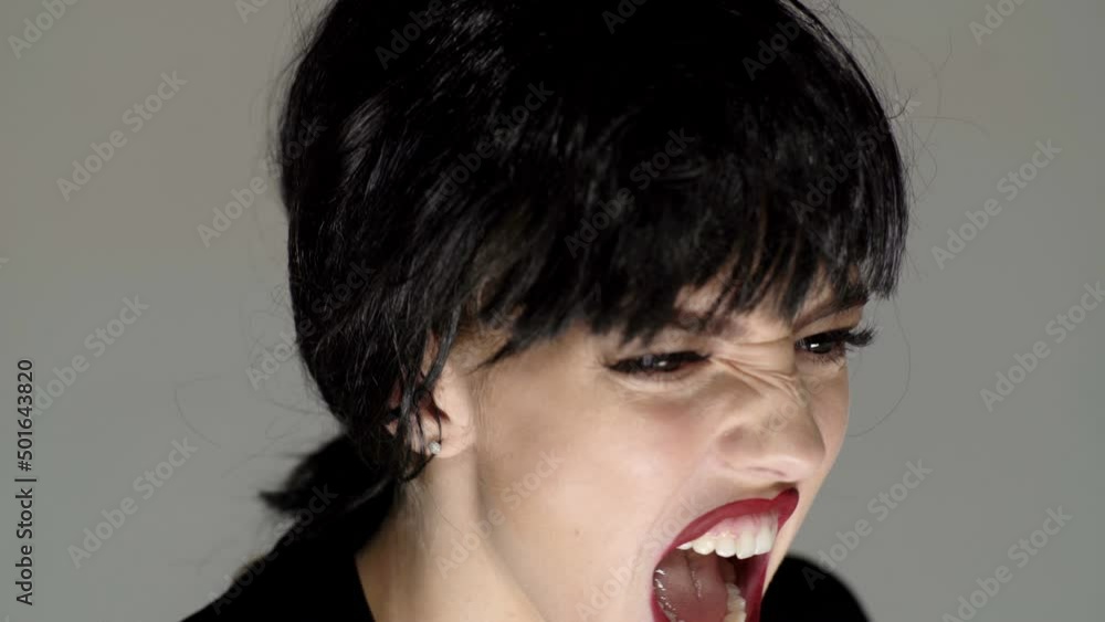 Angry woman screaming with rage, furious and dangerous. Girl shouting ...