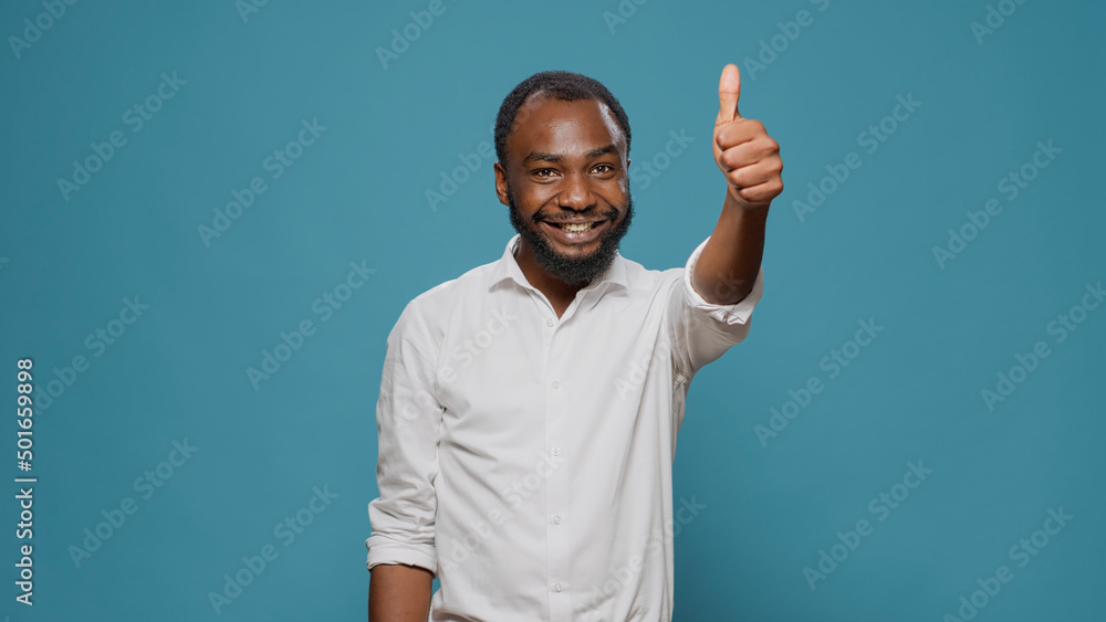 Optimistic person doing thumbs up gesture and approving idea, feeling ...