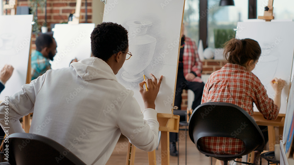 African american student drawing contemporary sketch in art class ...