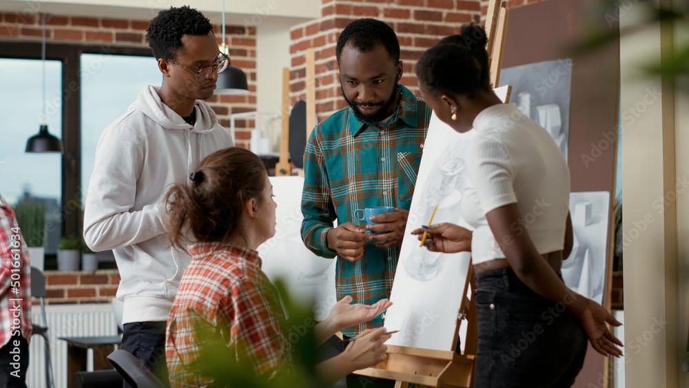 Diverse group of students brainstorming ideas to create vase drawing in ...