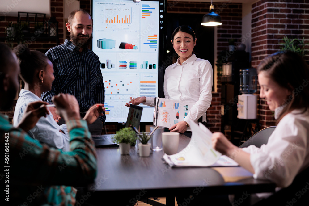 Startup business people talking and smiling at the end of late night ...