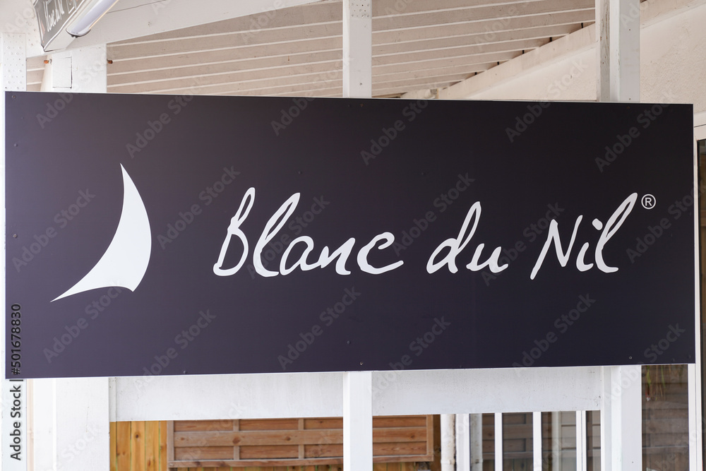 Blanc du nil logo brand and text sign facade front wall store French ...