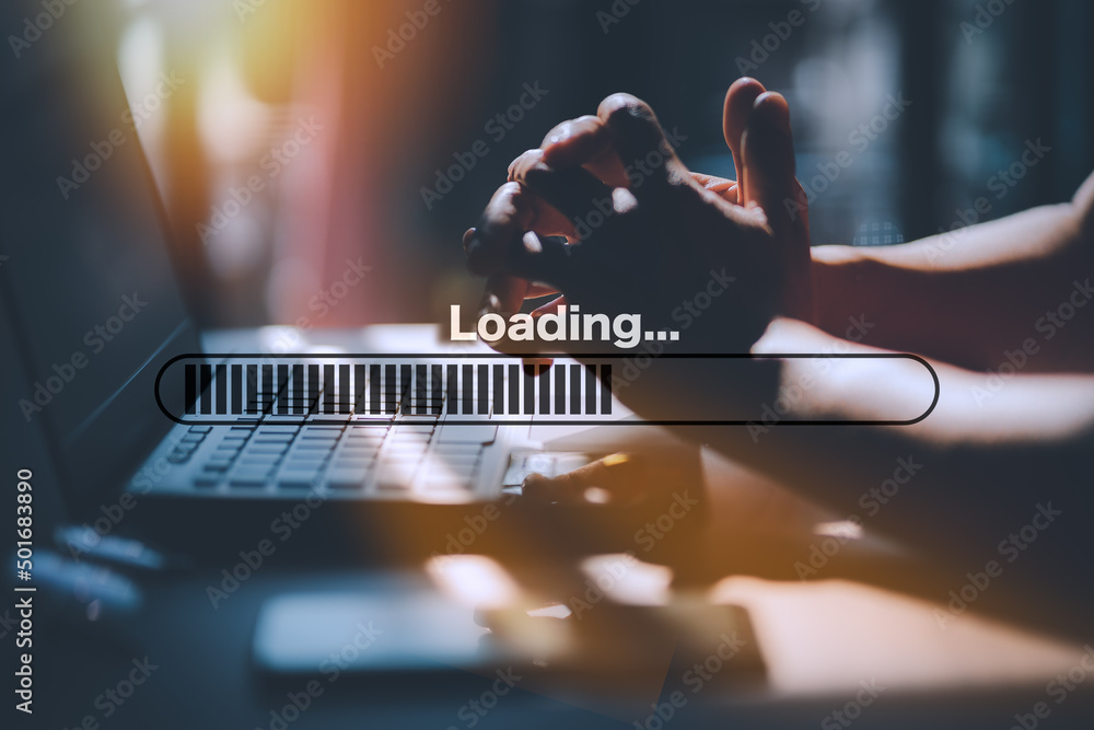 Man using laptop for download and waiting to loading digital business ...