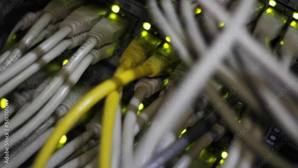 Working Ethernet switch in data center. UTP cables, jacks, blinking led ...