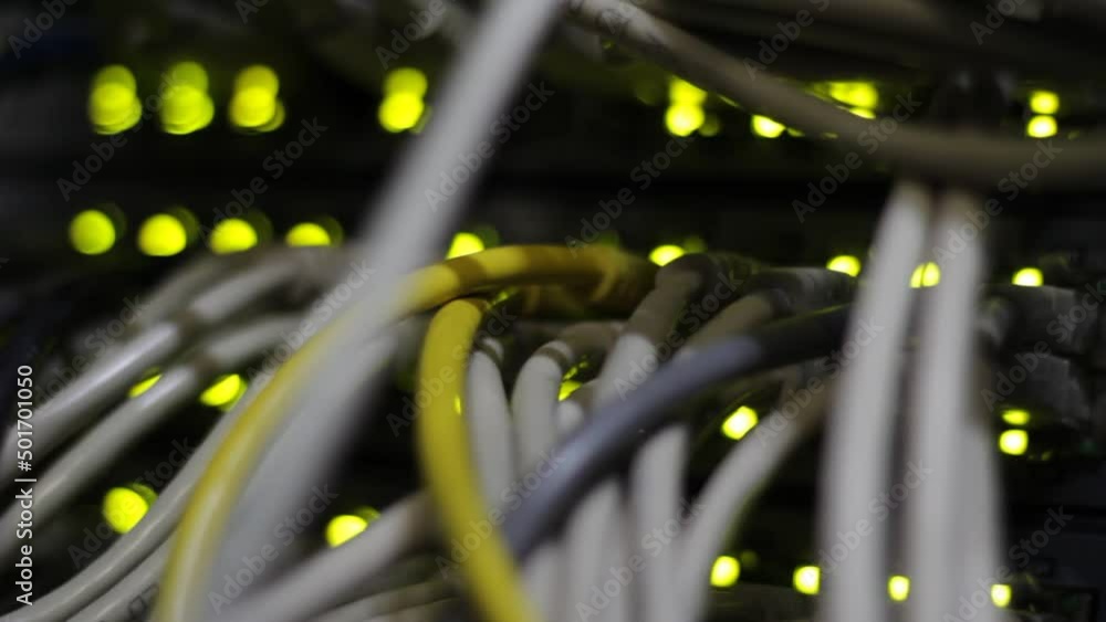 Working Ethernet switch in data center. UTP cables, jacks, blinking led ...