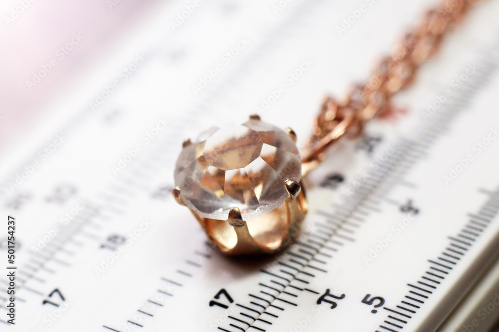 Gold chain with a large diamond on a ruler in a pawnshop Stock Photo ...