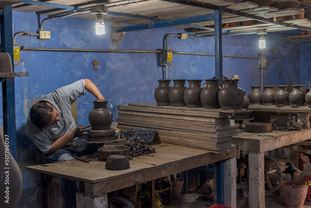 Workstation of a latin craftsman that produces talavera pottery Stock ...