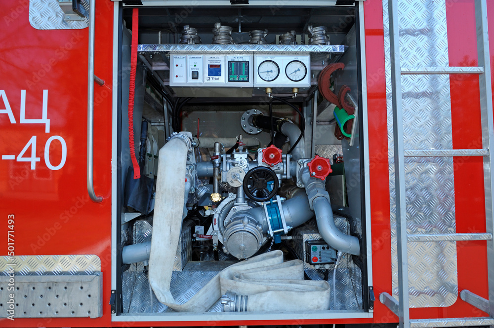Part of equipment of a firetruck compartment: water pump, control panel ...