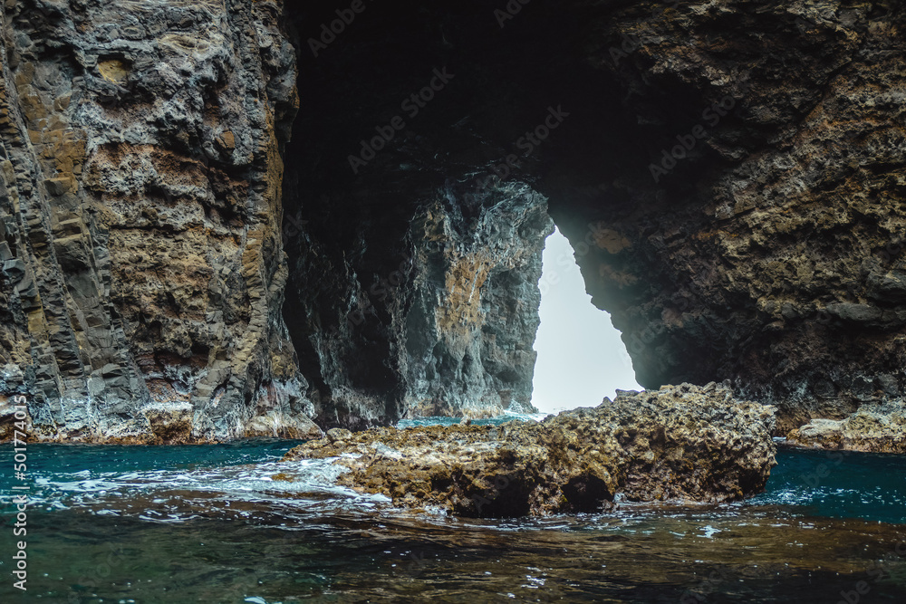 Deep sea caves and rocky formations on the Napali coast of the Hawaiian ...