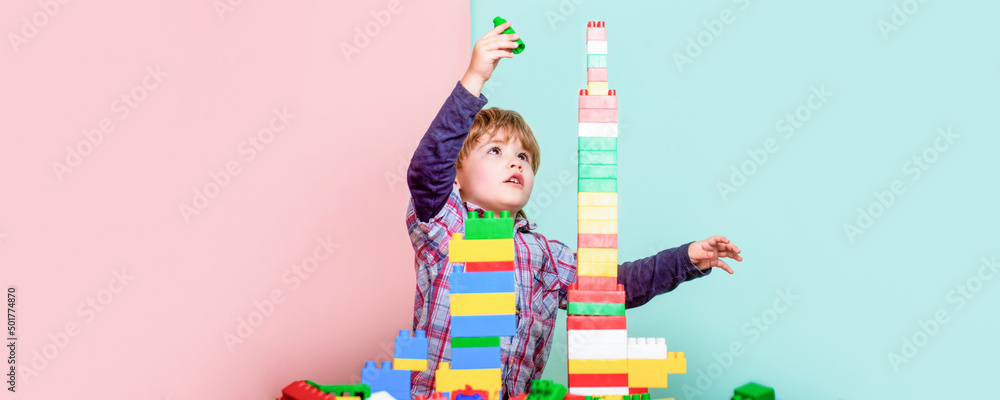 Boy playing with construction blocks at kindergarten. Child playing ...