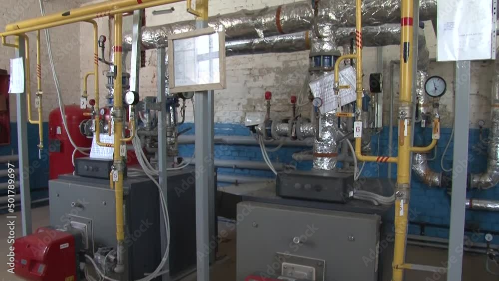 Boiler room with pipes, valves and sensors.Manometer, pipes and faucet ...