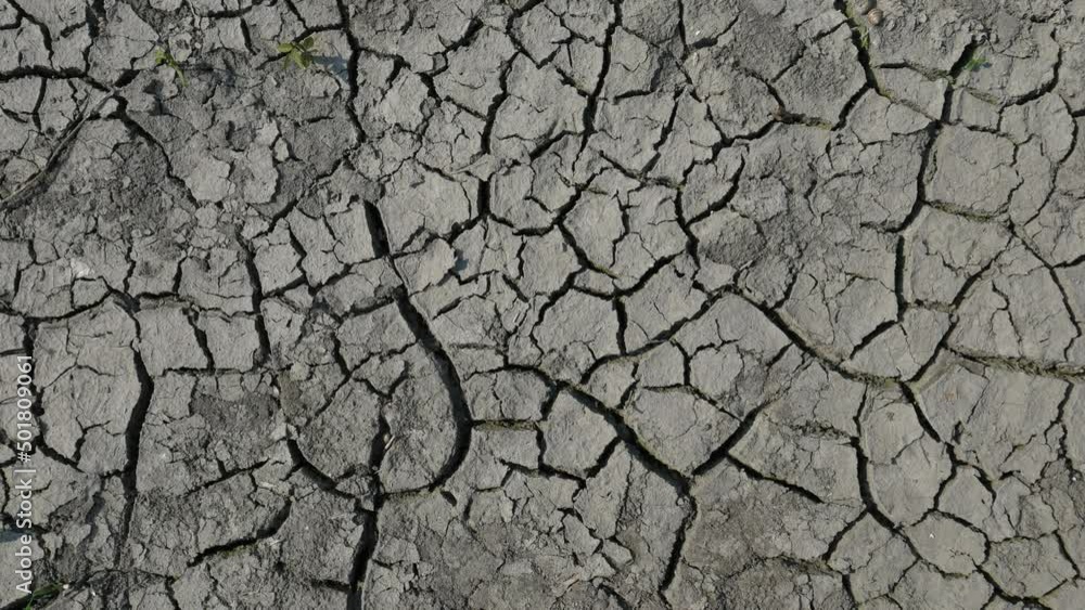 Lifeless desert land dry lake bed with cracked ground. Drought and ...