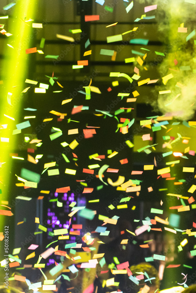 Thousands of confetti shot on air during a night festival. Ideal image ...