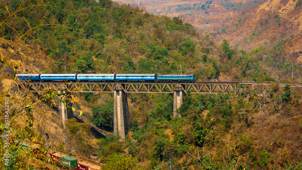 Indian railway passing a classic bridge Stock Photo | Adobe Stock