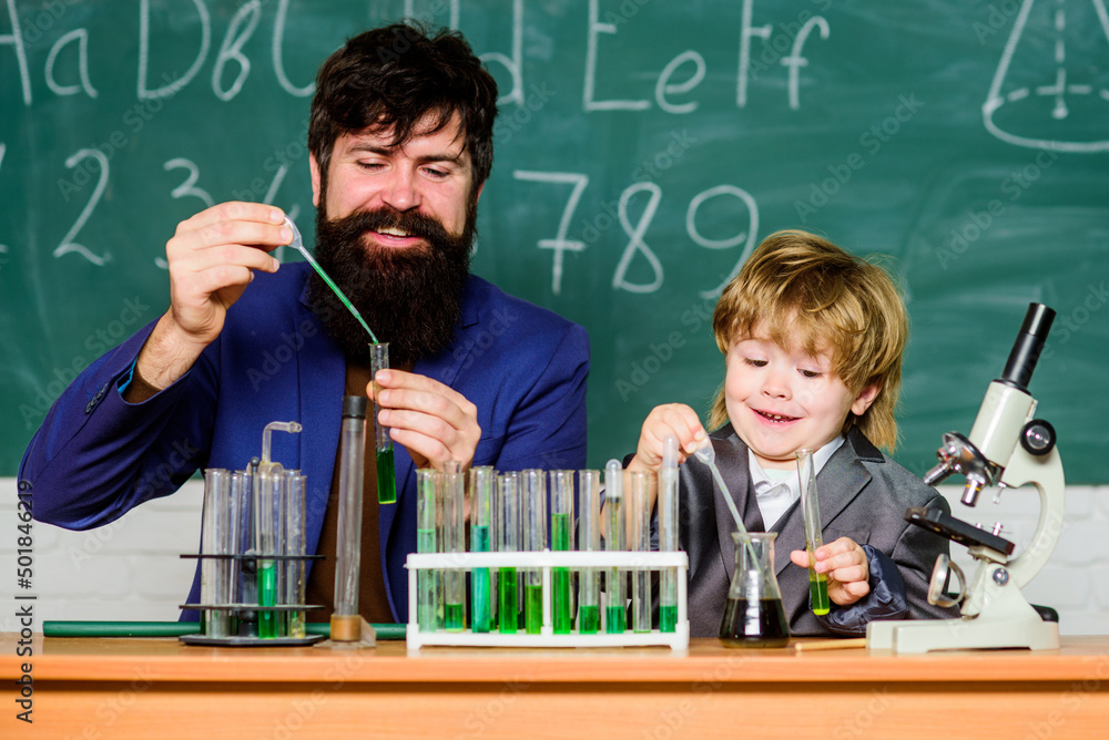 bearded man teacher with little boy. biotechnoloy research concept ...