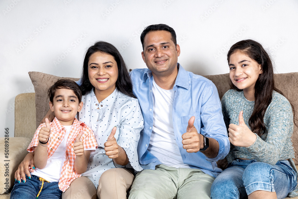 portrait of happy Indian Family with thumbs up Stock Photo | Adobe Stock