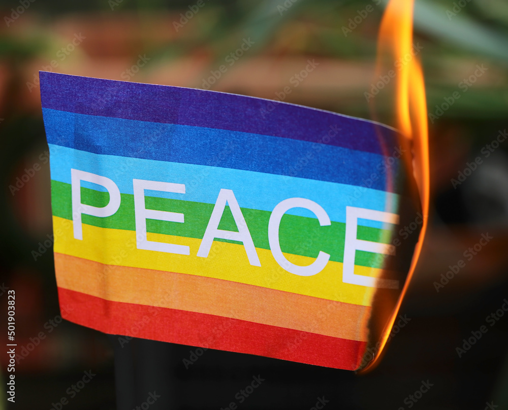 peace flag with the colors of the rainbow and the big text while ...