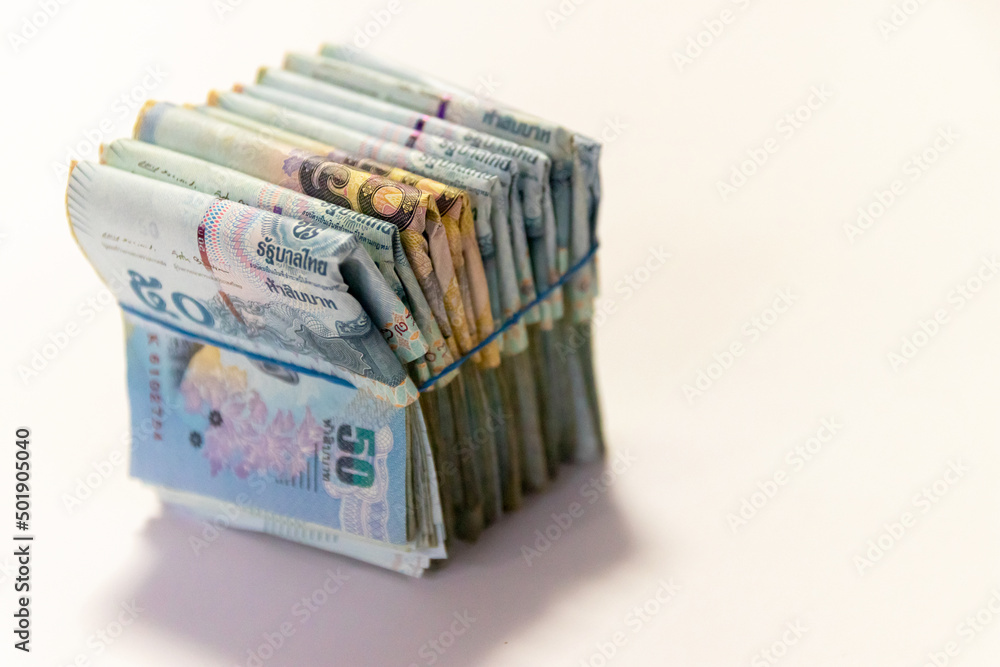 50 Thailand (THB) banknotes. The baht is the official currency of ...