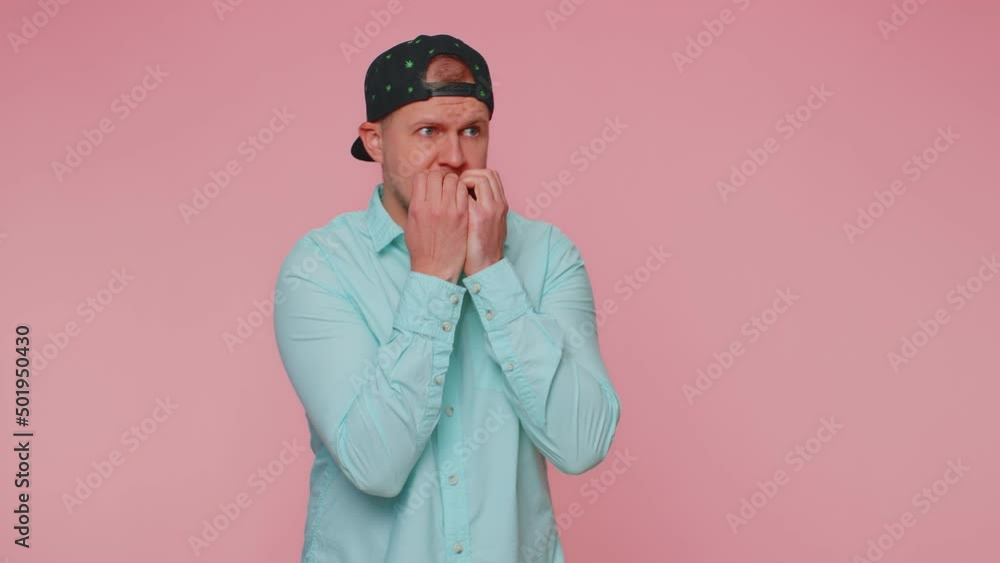 Panic attack. Upset scared frightened bearded adult man biting nails ...