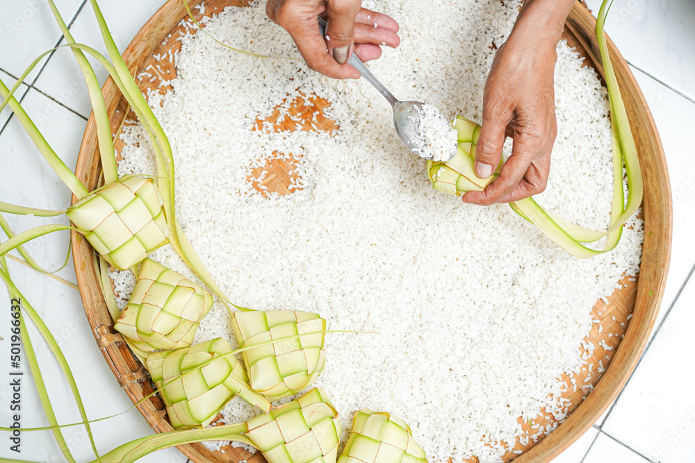 The process of making ketupat is a traditional food during Eid. Put the ...
