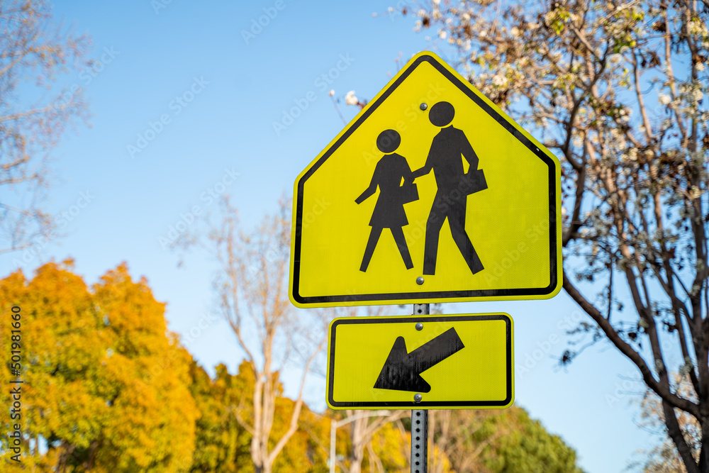 Yellow sign for school zone. School warning sign. Stock Photo | Adobe Stock