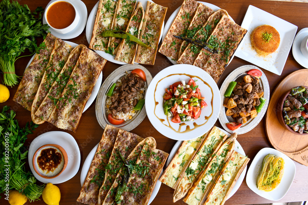 Traditional Turkish cuisine. Pizza, pita, pidesi, sucuk, hummus, kebab ...