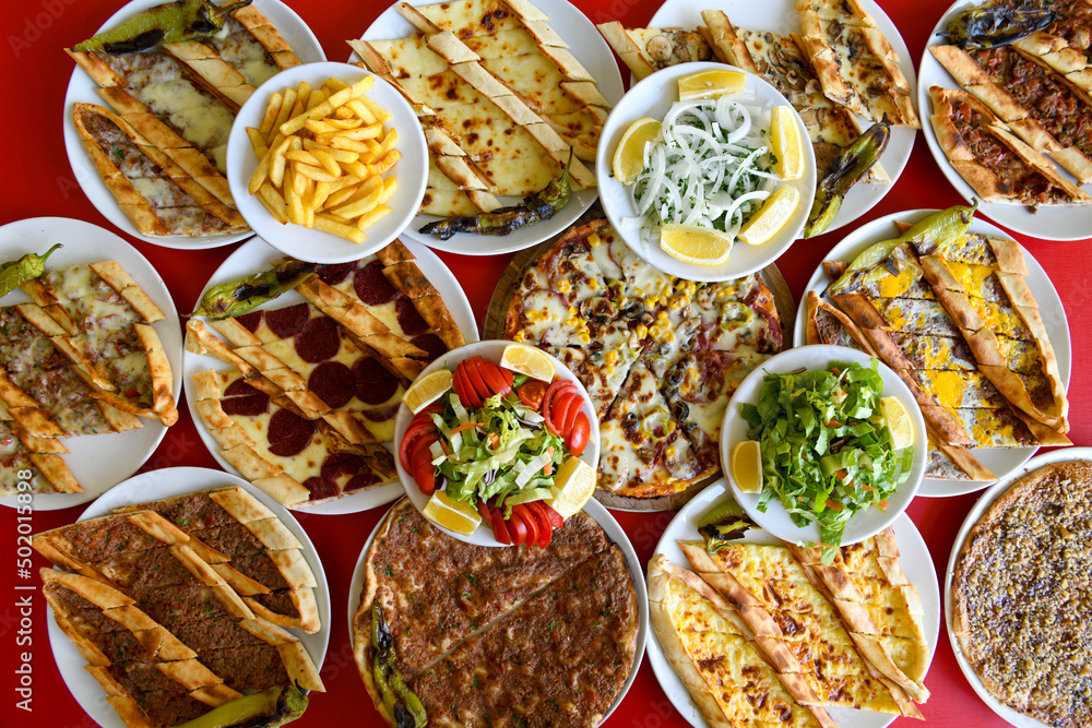 Traditional Turkish cuisine. Pizza, pita, pidesi, sucuk, hummus, kebab ...