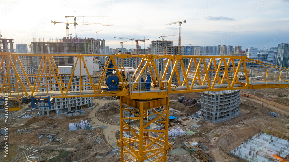 Construction crane on the background of the construction of the city ...