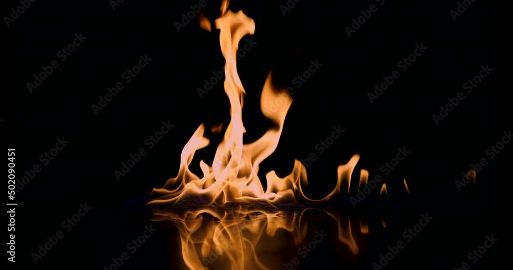 Beautiful flames running across a reflective surface in 4K slow motion ...