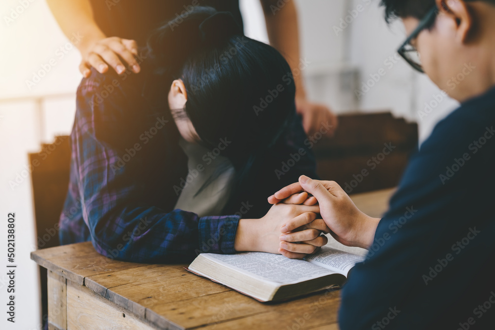 A Group of Christians pray to bless and pray for each other in church ...