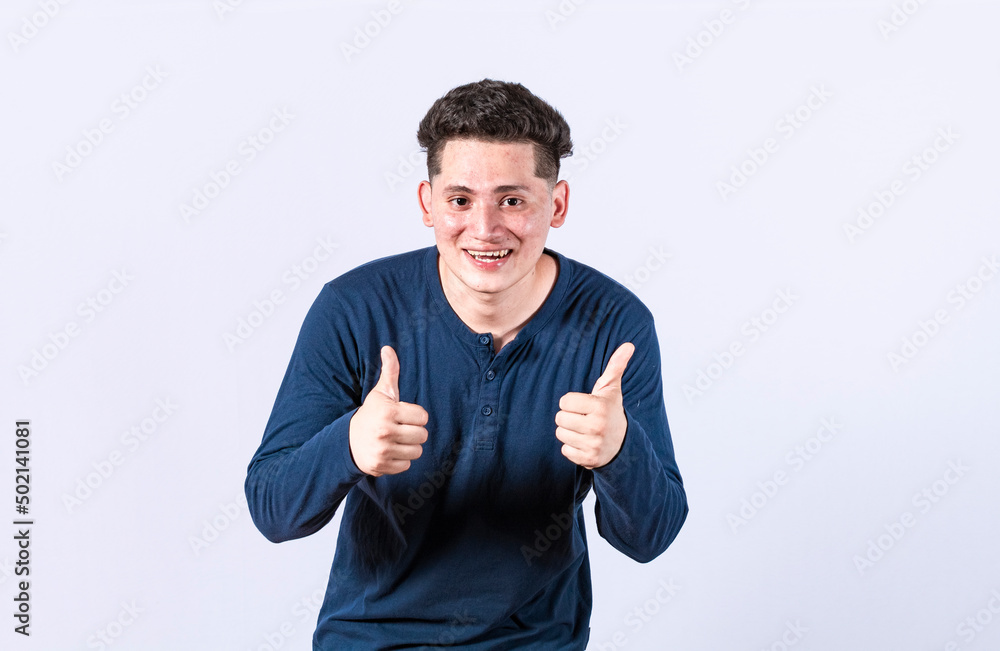 Positive guy with thumbs up doing ok, young man with thumbs up on white ...