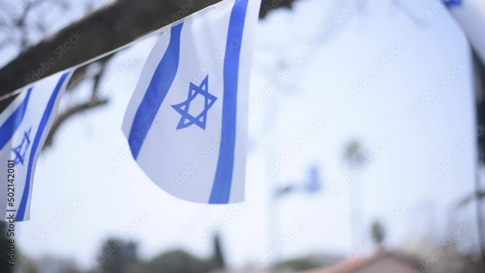 Israel flags white and blue with star Magen David fluttering in wind ...