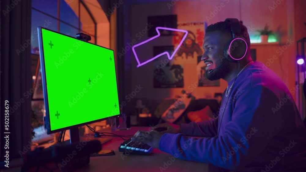 Excited Gamer Playing Online Video Game with a Mock Up Green Screen on ...