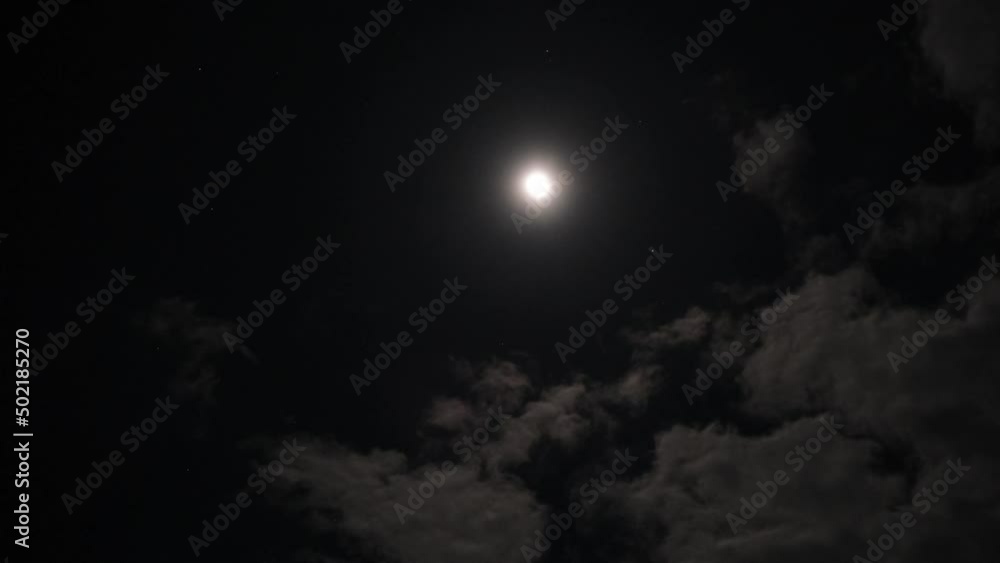 Timelapse Full moon at night with clouds in real time. the mystery of ...