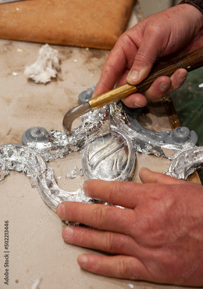 Silvered frame ready for burnishing with an agate stone tool. Silvering ...