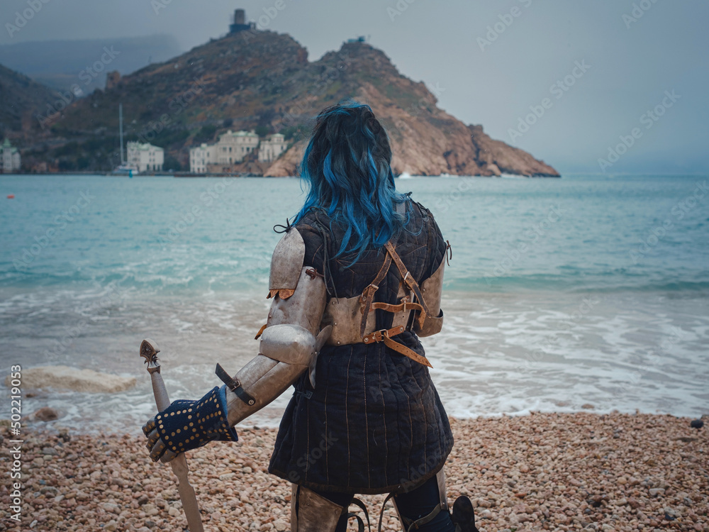 Medieval knight woman in armor prays, blessing before the battle. Stock ...