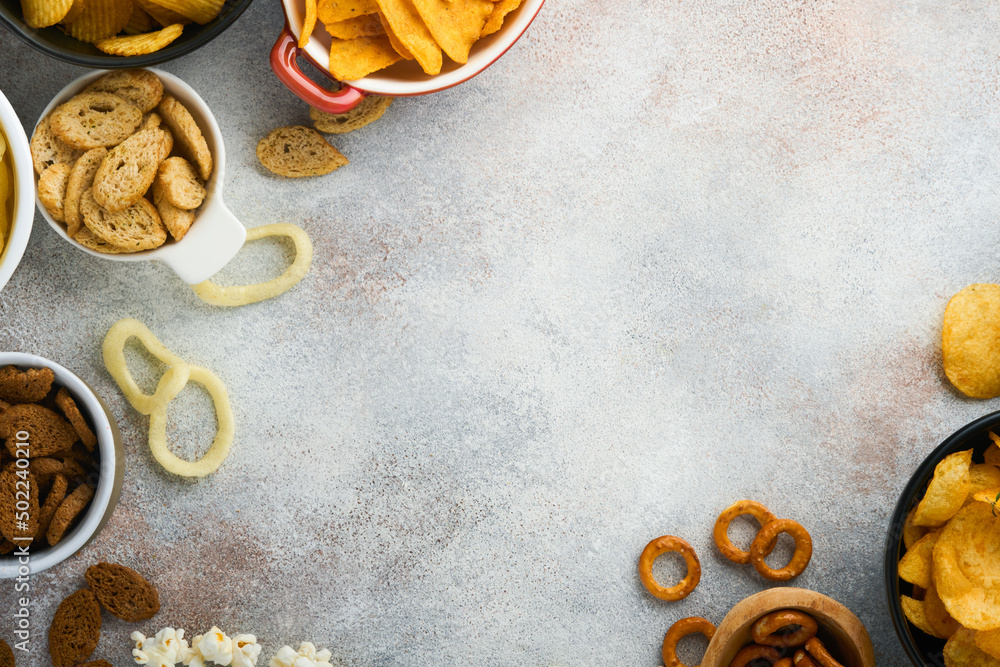 Snacks. Unhealthy food. All classic potato snacks with peanuts, popcorn ...