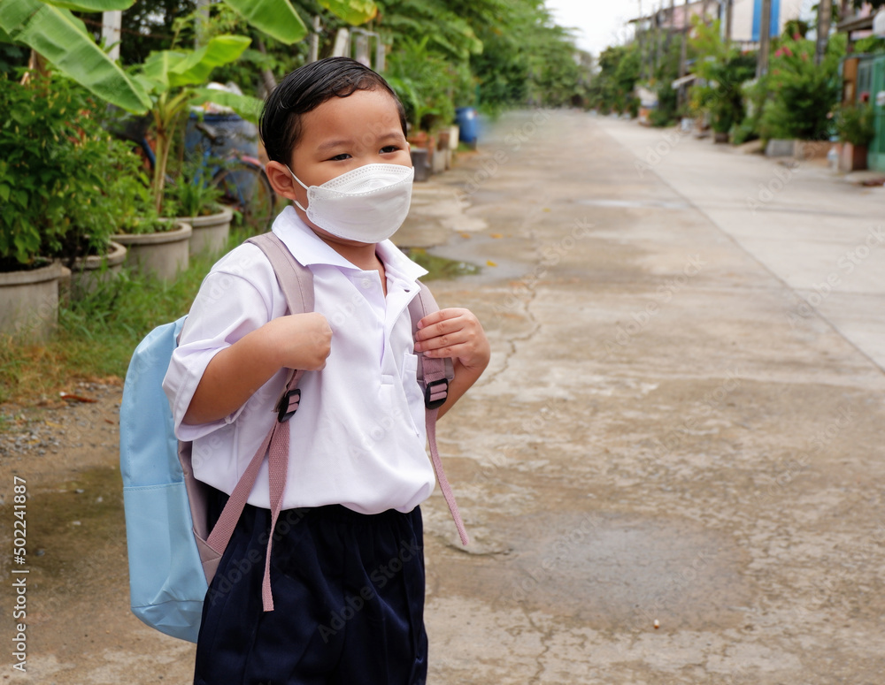 Portrait of Asian boy student in school uniform wearing a white shirt ...