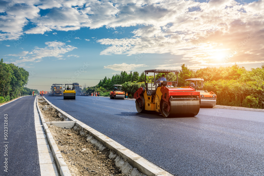Construction site is laying new asphalt pavement, road construction ...