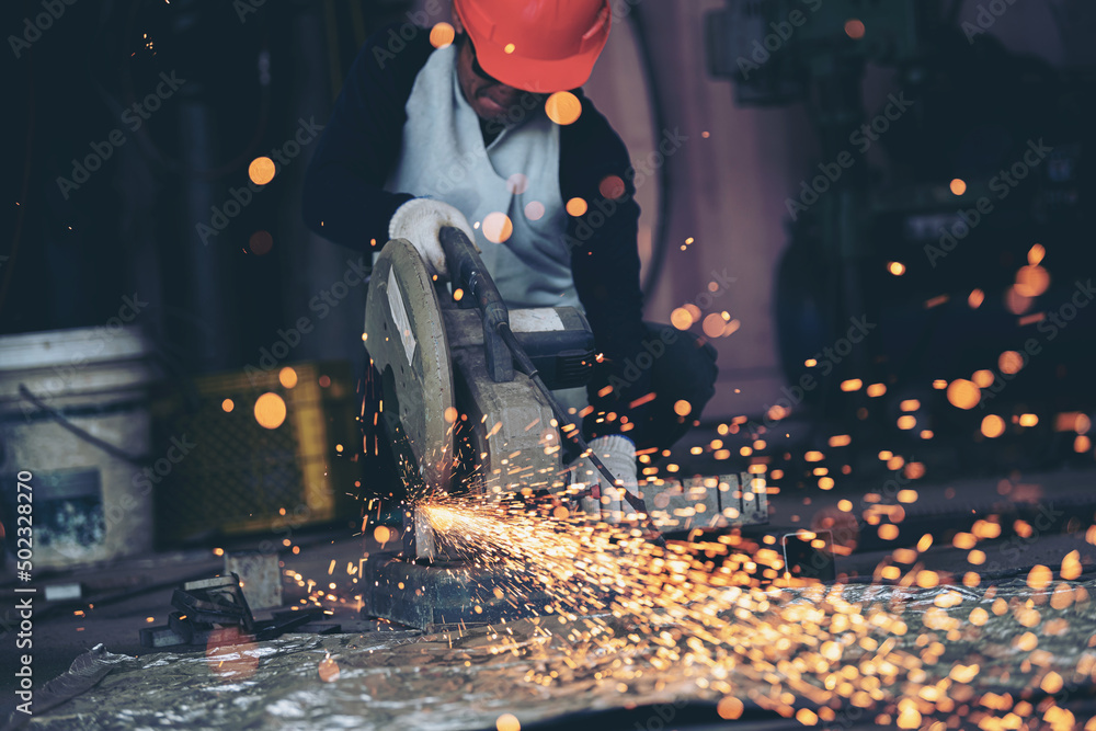 industrial engineer working on cutting a metal and steel with compound ...