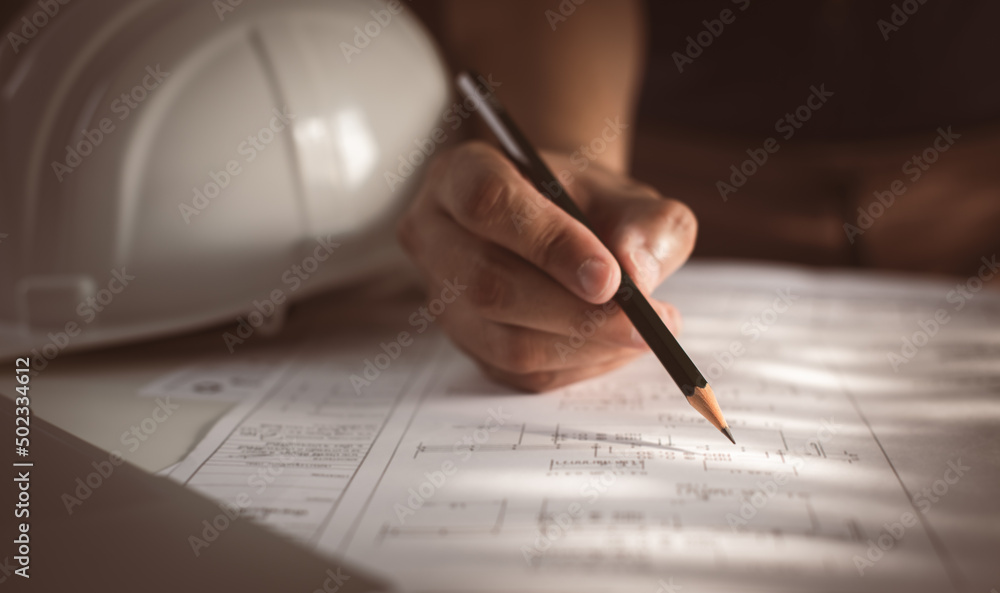 Architect working on blueprint. Architects workplace - architectural ...