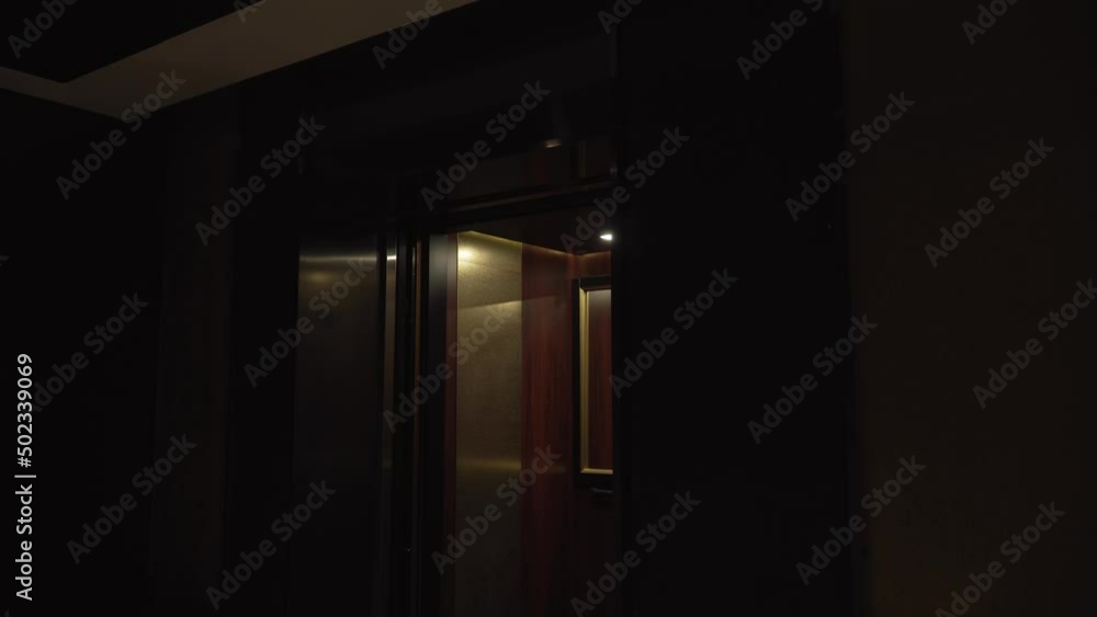 Smooth opening of the empty elevator doors in dark lobby. Elevator ...
