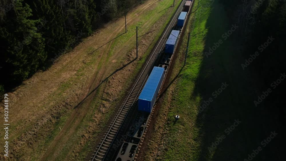 Shipping containers transportation on freight train by railway. Cargo ...