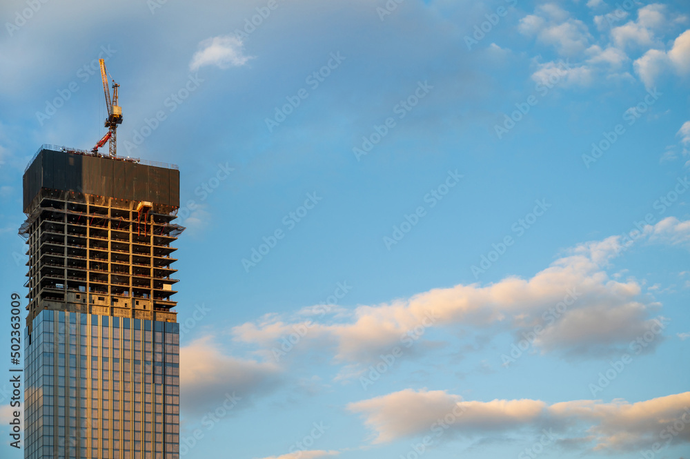 Tall and thin skyscraper under construction with concrete core still ...