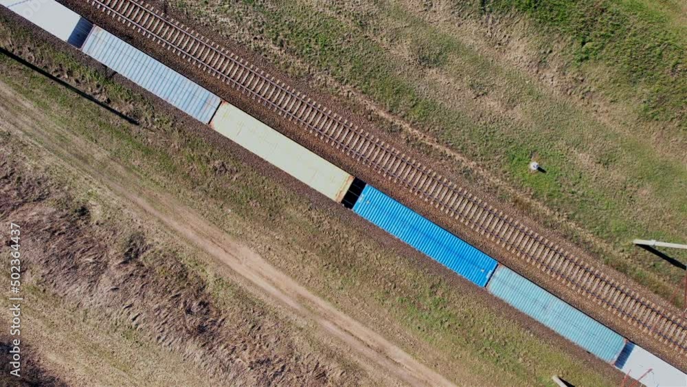 Shipping containers transportation on freight train by railway. Cargo ...