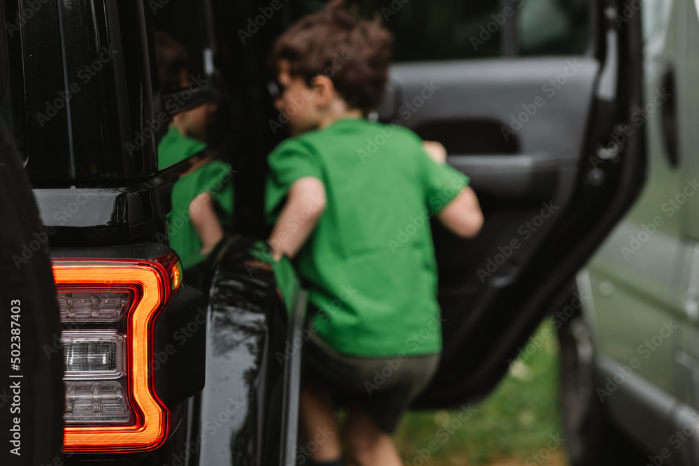 Child getting into modern car Stock Photo | Adobe Stock