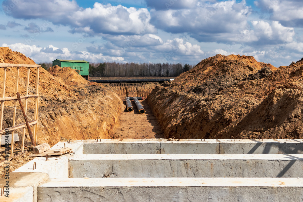Laying of underground pipes in concrete chamber. Installation of water ...